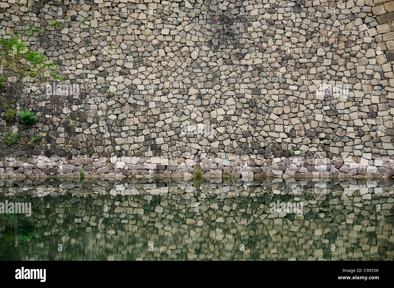 Strong castle fortification wall mirrored in water Stock Photo - Alamy