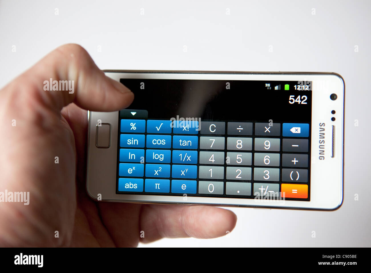 Use the calculator on a Samsung Galaxy S2 Stock Photo - Alamy