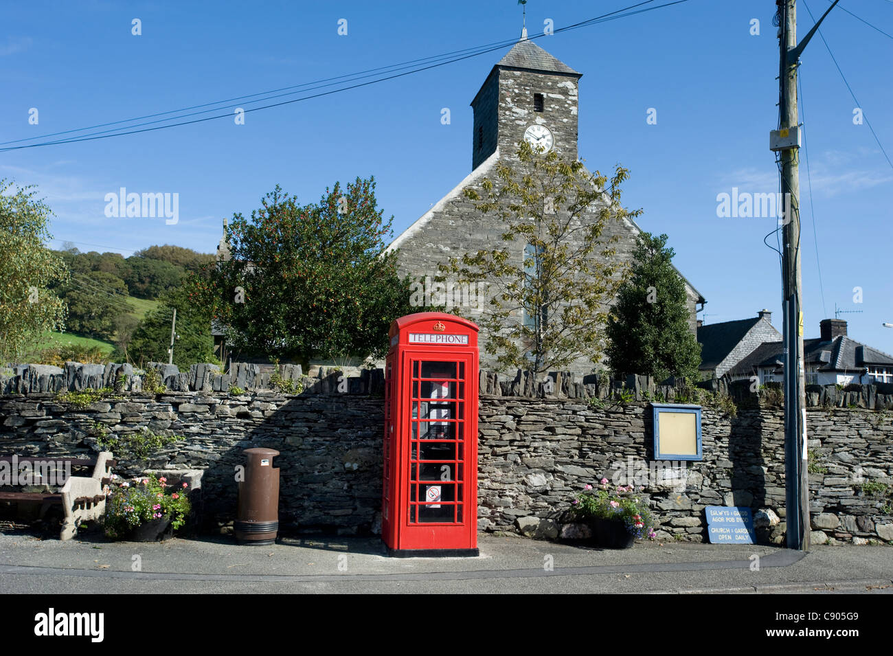 A Red Telephone box stands in front of St. Peter Ad Vincula Church in ...