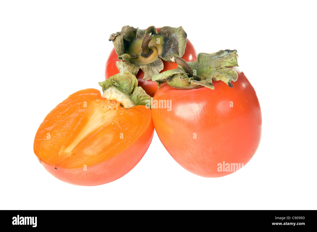 three ripe persimmon isolated on white background Stock Photo - Alamy