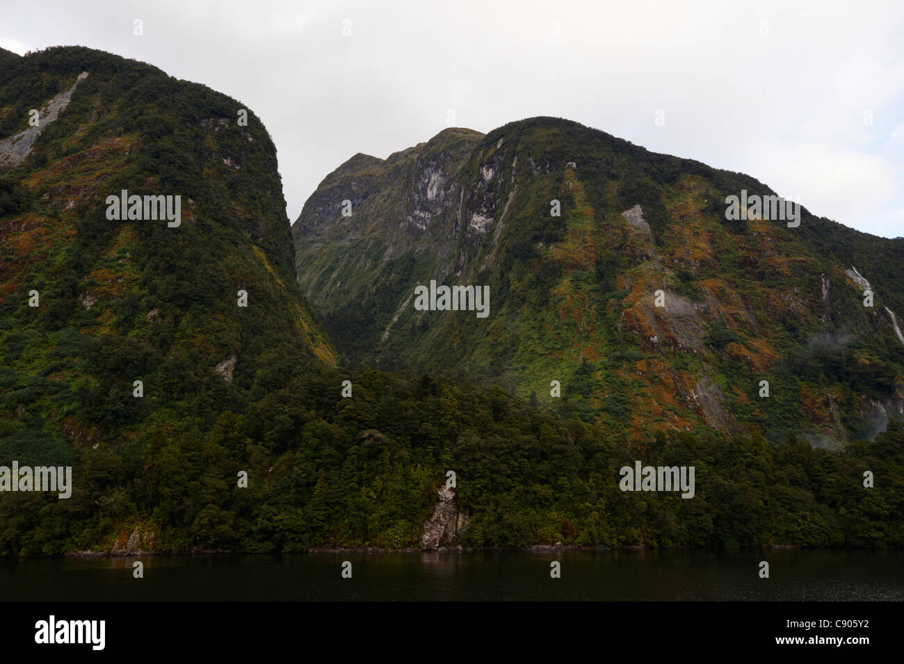 Steep rugged mountains of Doubtful Sound, Fiordland National Park ...