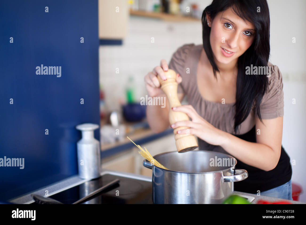 young woman cooking pasta Stock Photo - Alamy