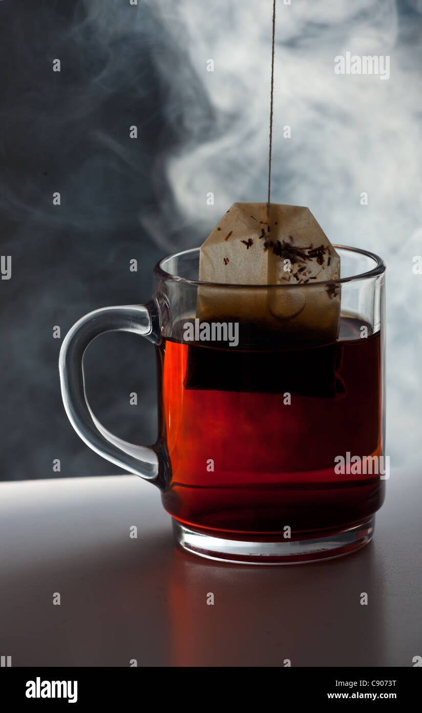 tea bag and a glass cup Stock Photo - Alamy