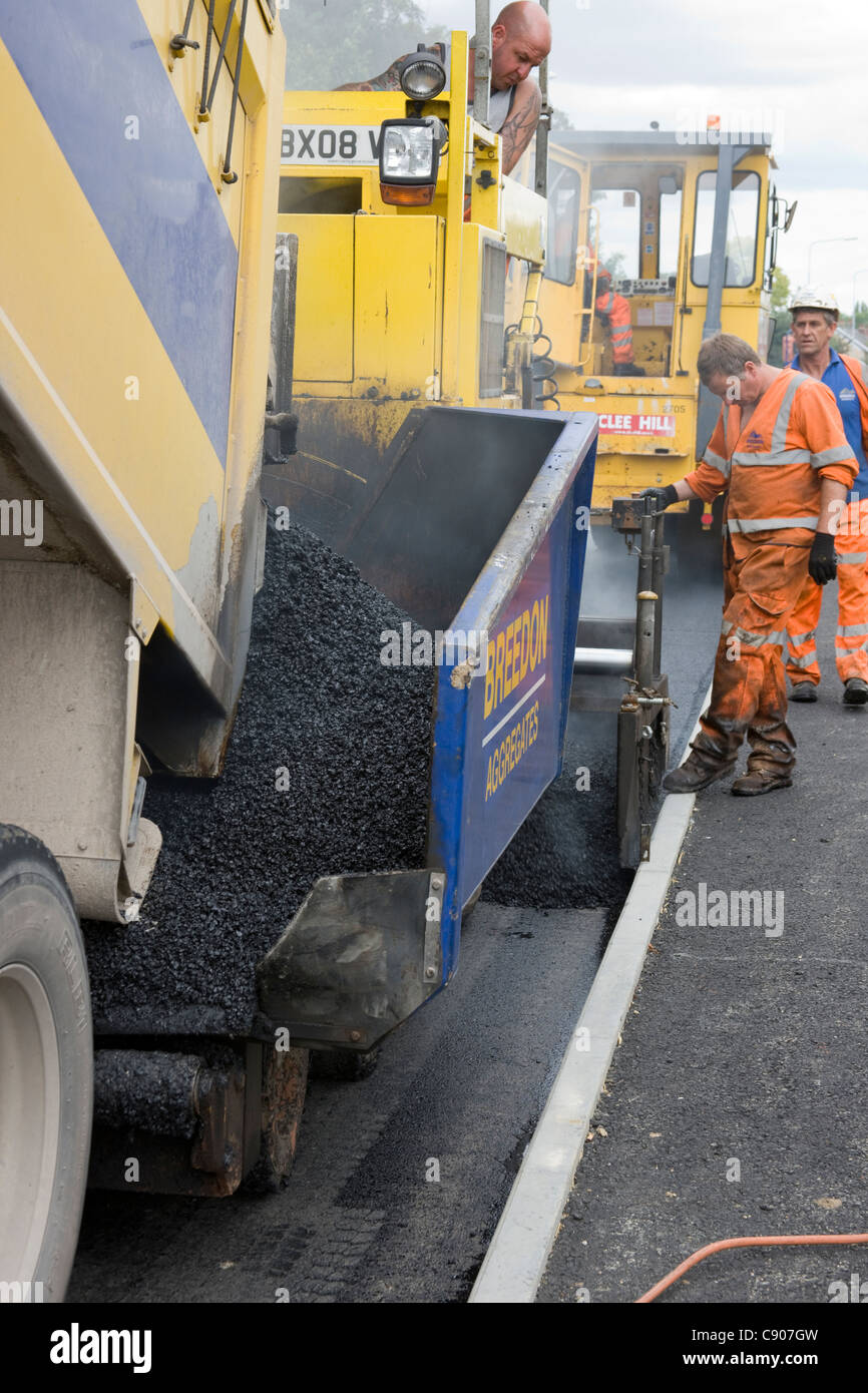 Guiding tarmac laying machine hi-res stock photography and images - Alamy
