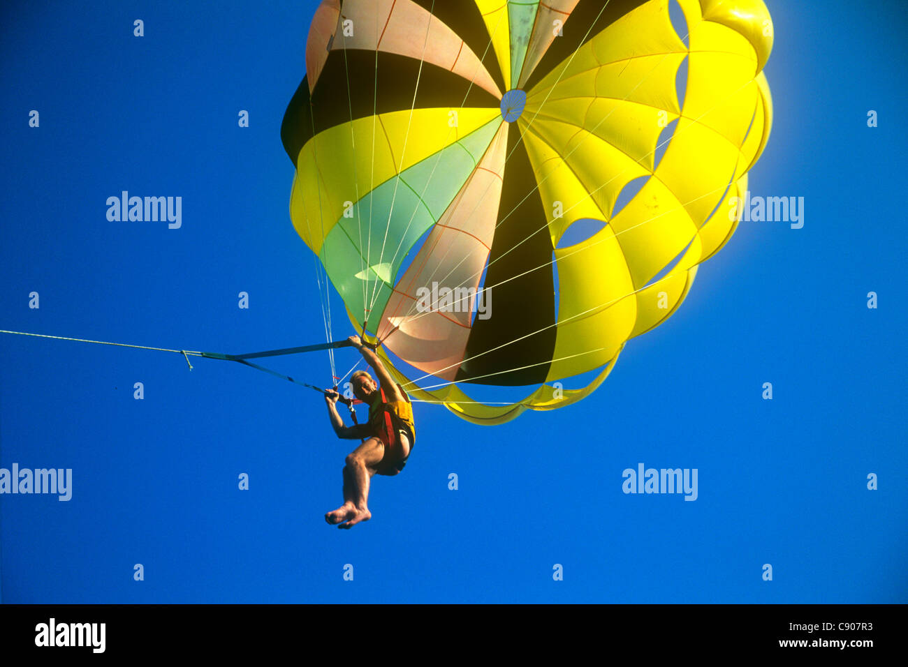 A tourist taking a parachute ride in the sky above Doha Qatar Stock ...