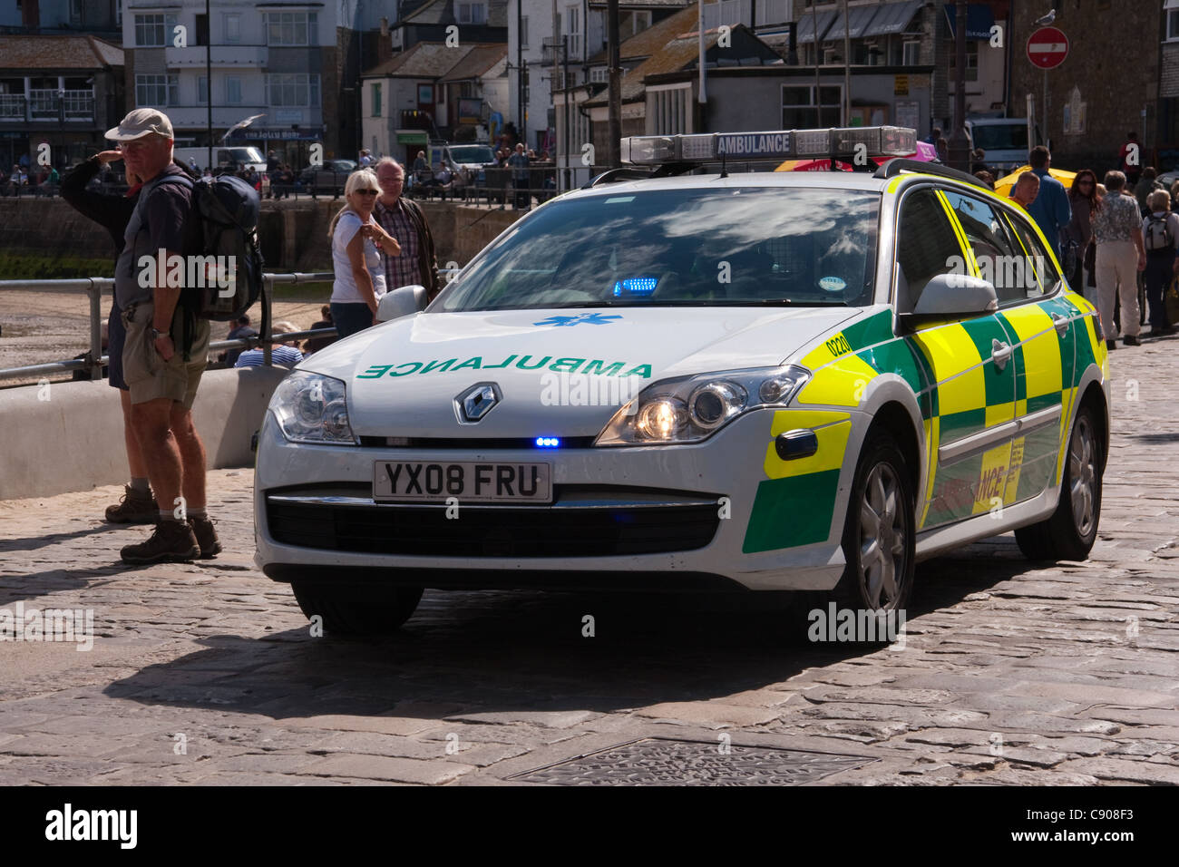 Ambulance Paramedic driving speeding along habourside at St. Ives ...
