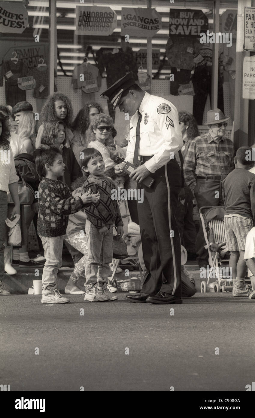 firefighter showing children radio during veterans day parade ...