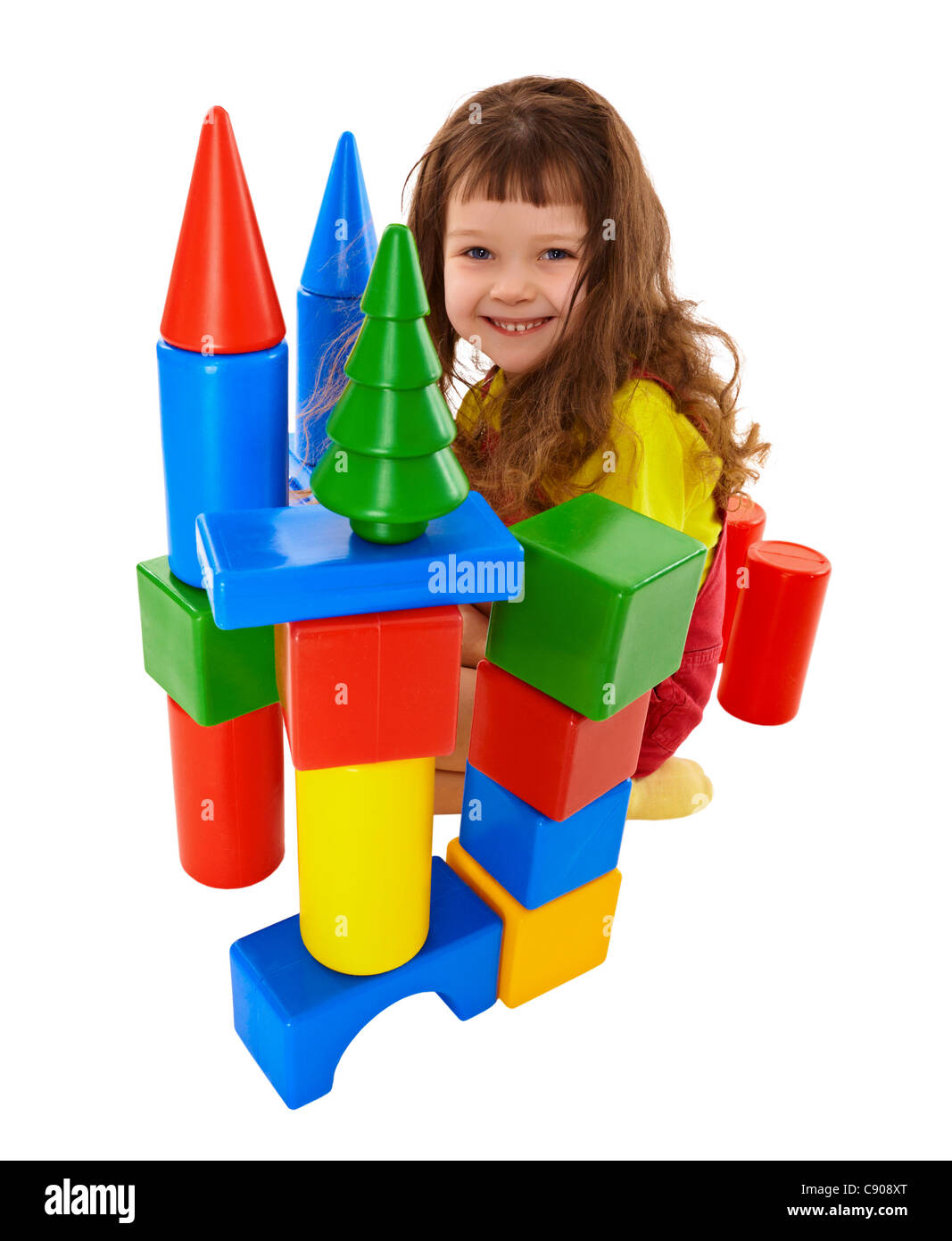 Small child built a castle from color cubes isolated on white ...