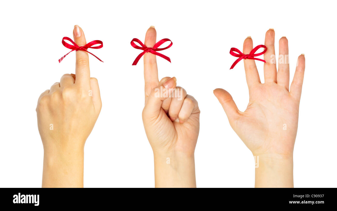 Red bow on finger isolated on white background Stock Photo - Alamy
