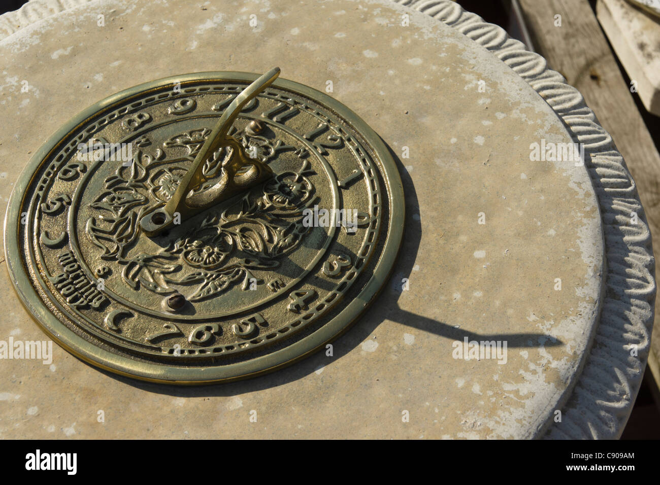 Sundial with shadow cast Stock Photo - Alamy