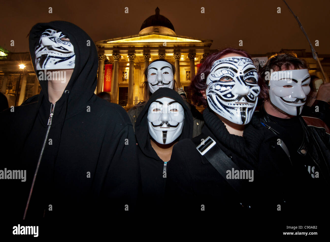 Followers of Anonymous UK arrive in Trafalgar Square sporting V for ...