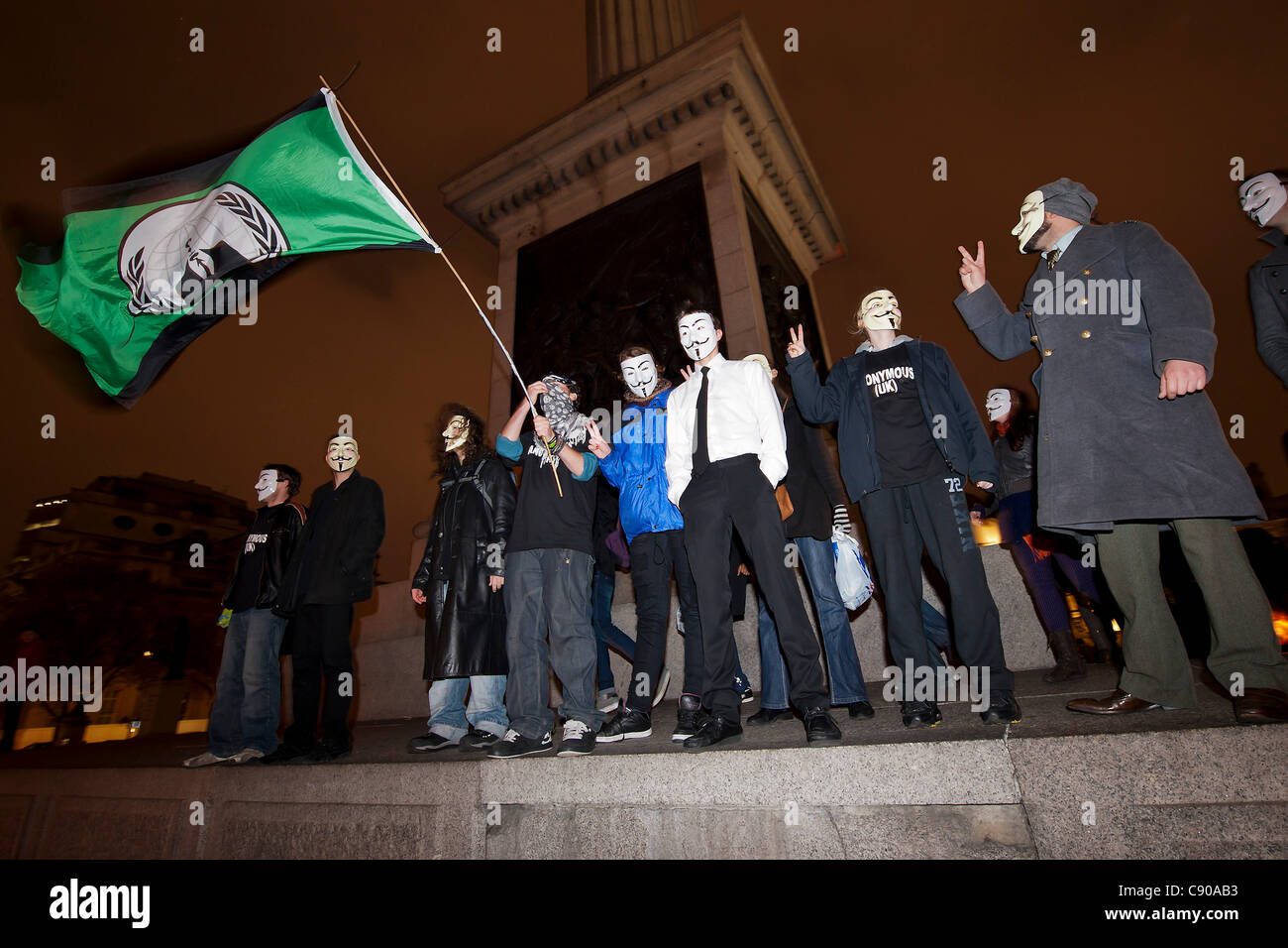 Followers of Anonymous UK arrive in Trafalgar Square sporting V for ...
