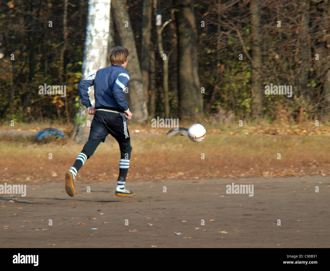 Male soccer player running with ball hi-res stock photography and ...