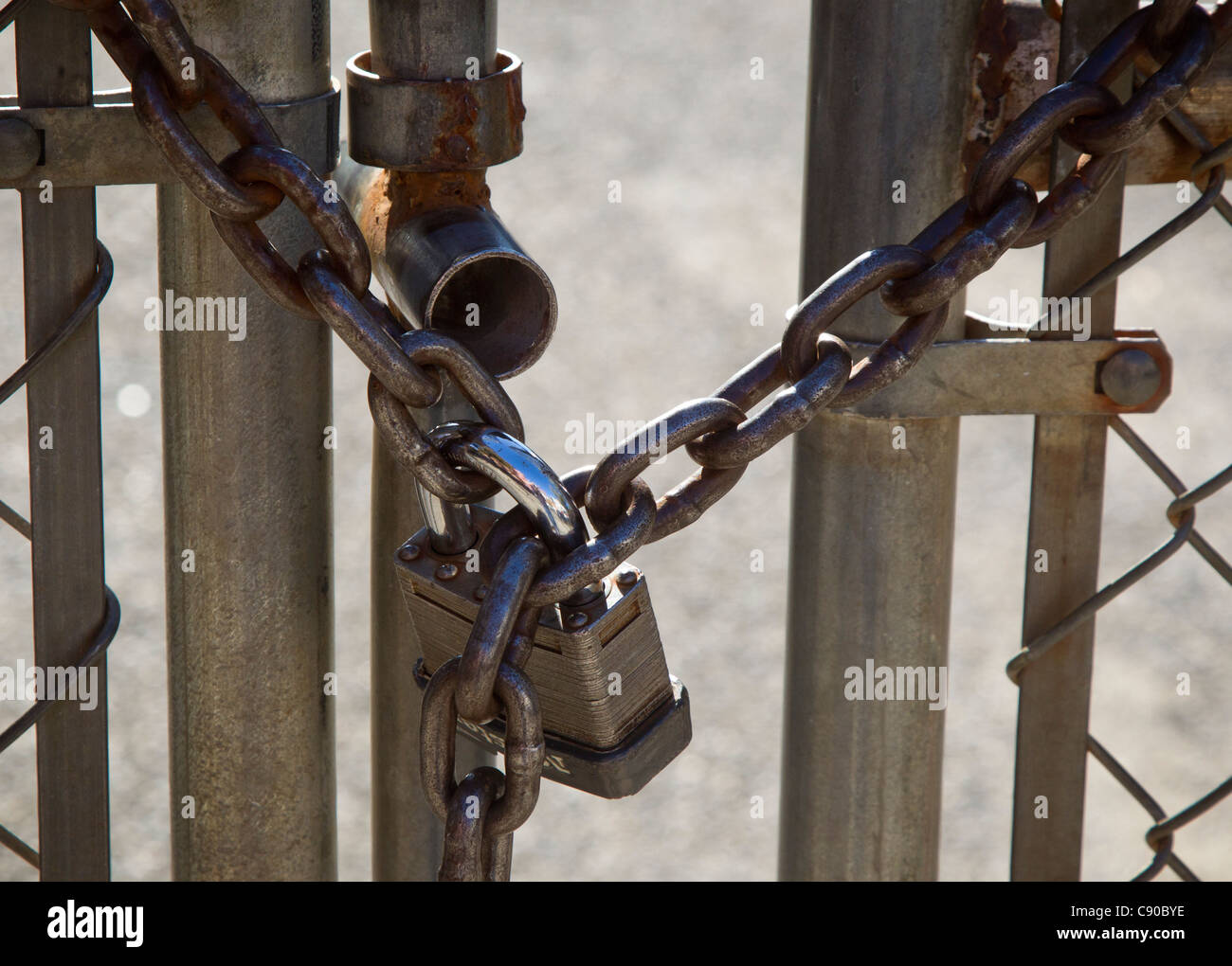 A lock and chain closing two gates Stock Photo - Alamy