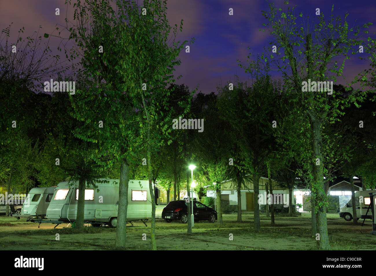 Mobile homes at a camping site at night Stock Photo - Alamy