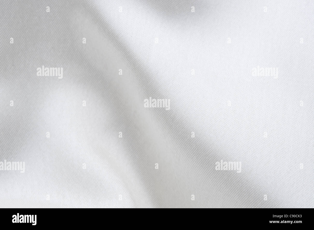 An image of white fabric shaped in a wave Stock Photo - Alamy
