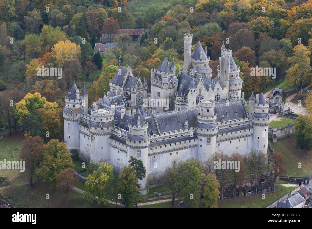 AERIAL VIEW. Pierrefonds Castle in the Compiègne forest with autumnal ...