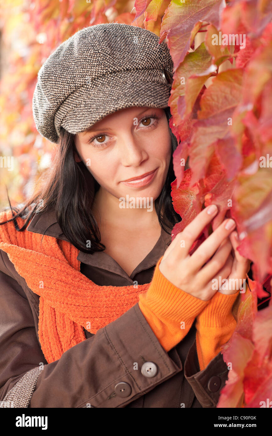 Autumn leaves portrait of beautiful female model posing fashion outfit ...