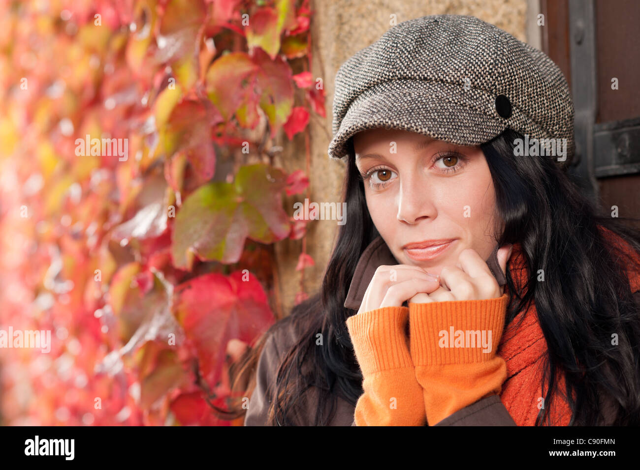 Autumn leaves portrait of beautiful female model posing fashion outfit ...