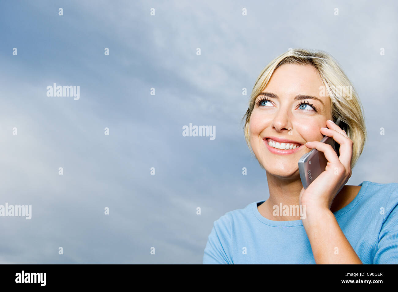 Woman using cell phone Stock Photo - Alamy