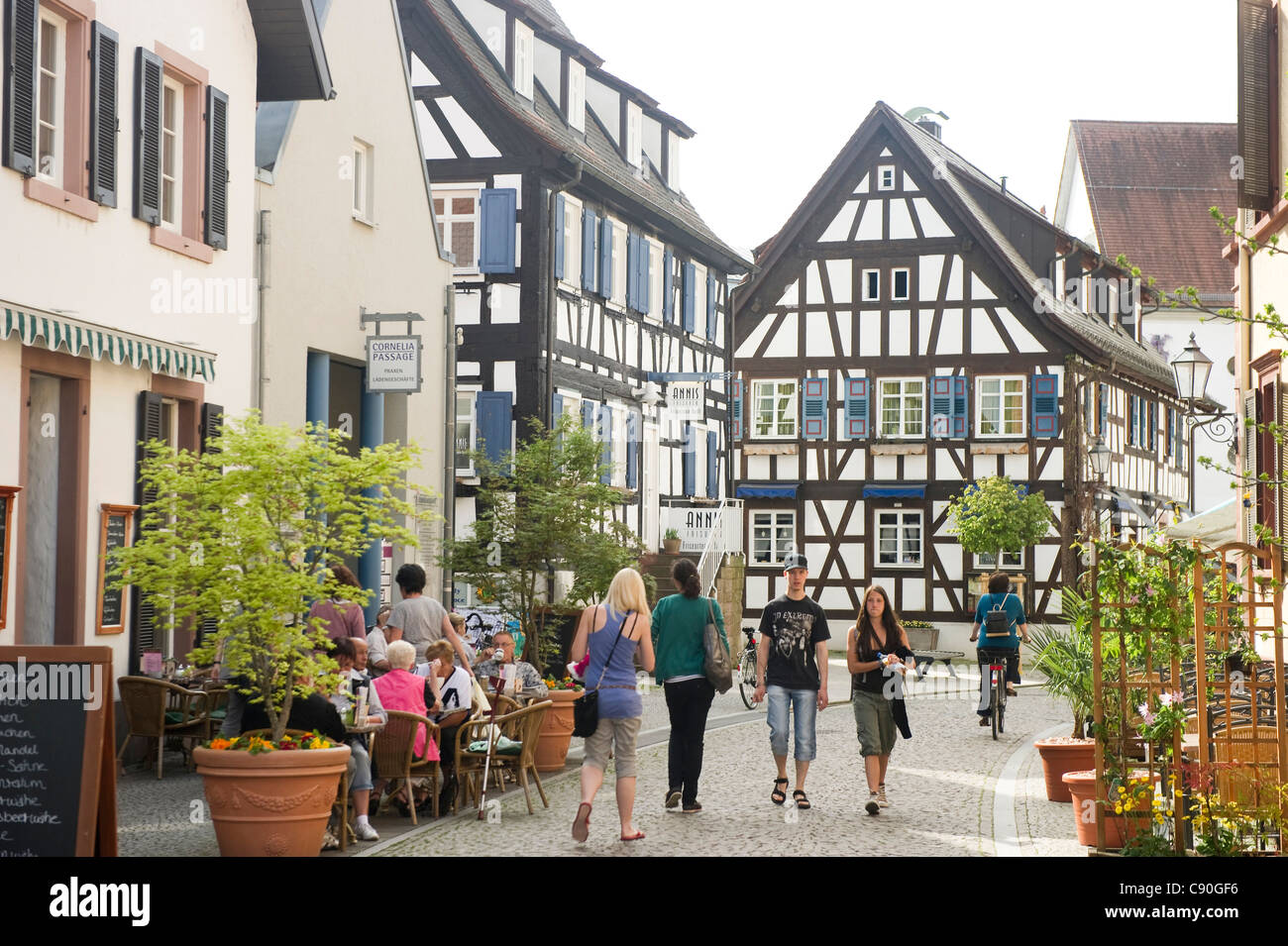 People in historic street, Emmendingen, Baden-Wuerttemberg, Germany ...