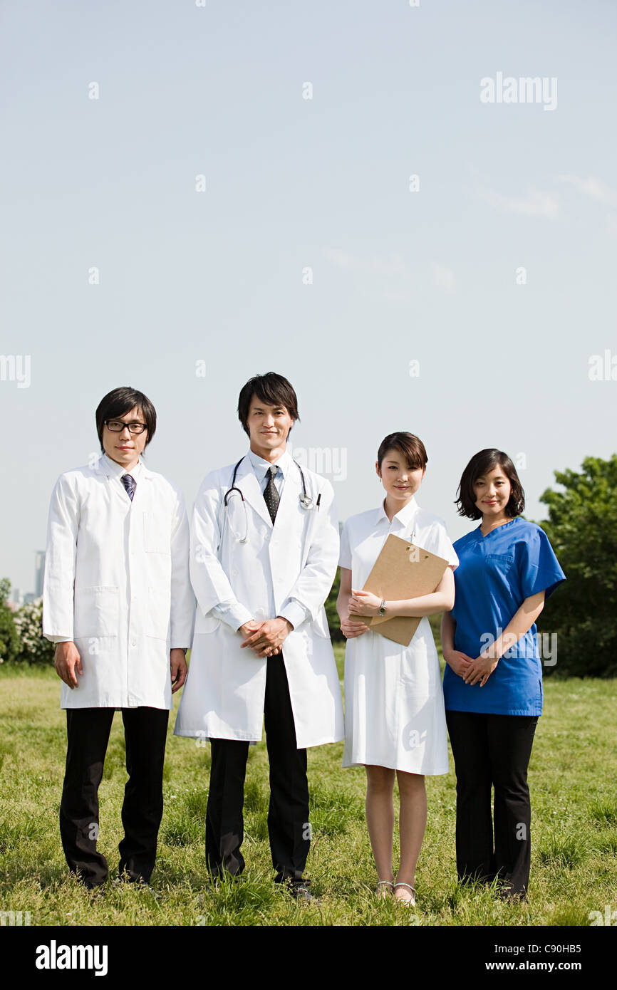 Male doctors and female nurses in field Stock Photo - Alamy
