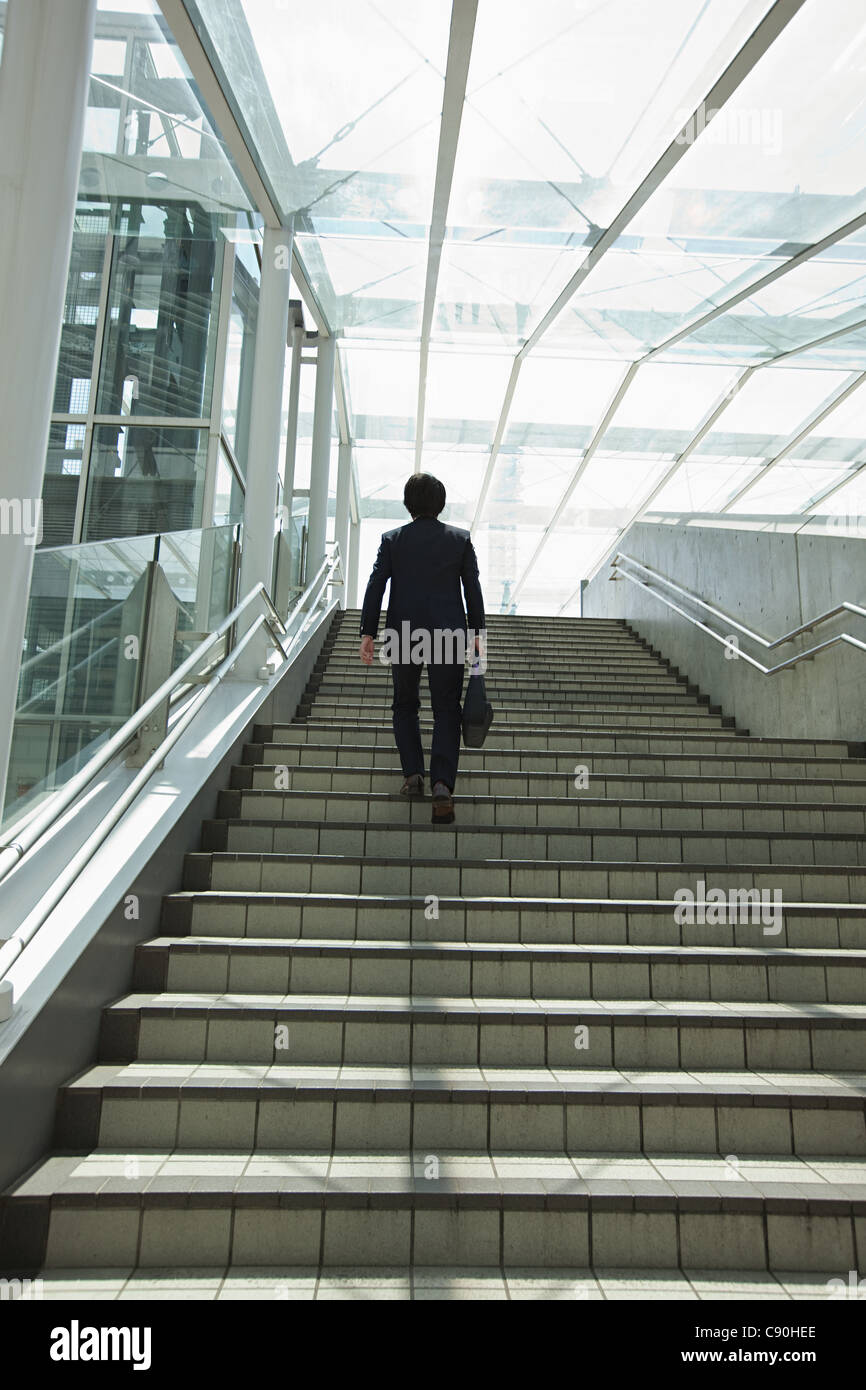 Man going up steps hi-res stock photography and images - Alamy