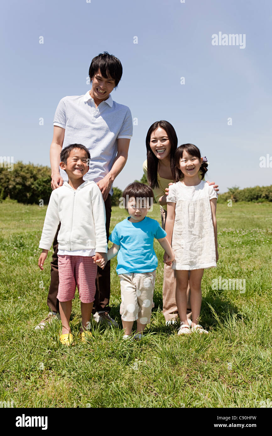 Family with three children in field, portrait Stock Photo - Alamy