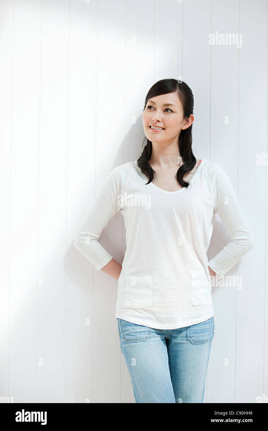 Woman wearing white top, portrait Stock Photo - Alamy