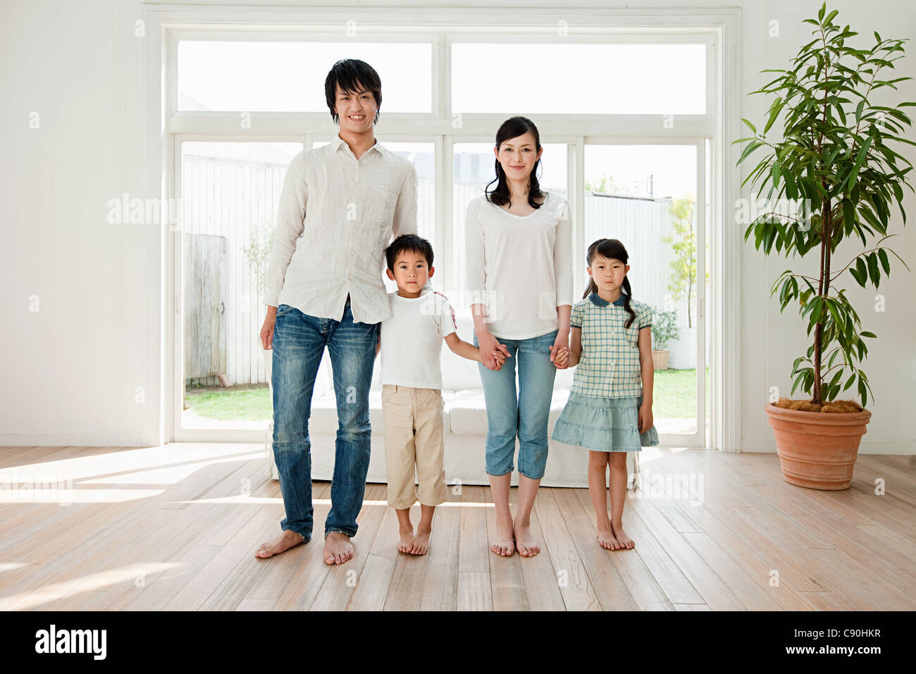 Family with two children at home, portrait Stock Photo - Alamy