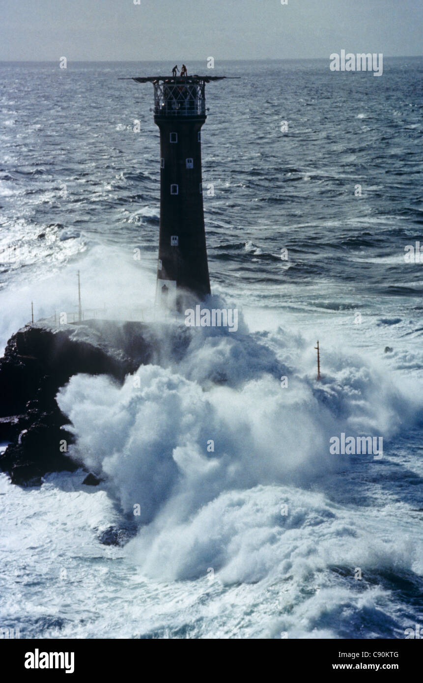 The Longships Lighthouse is a tall tower built on a rock in the middle ...