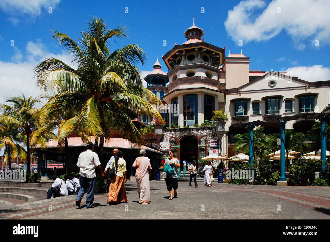 People in front of the Le Caudan Waterfront shopping center, Port Louis ...
