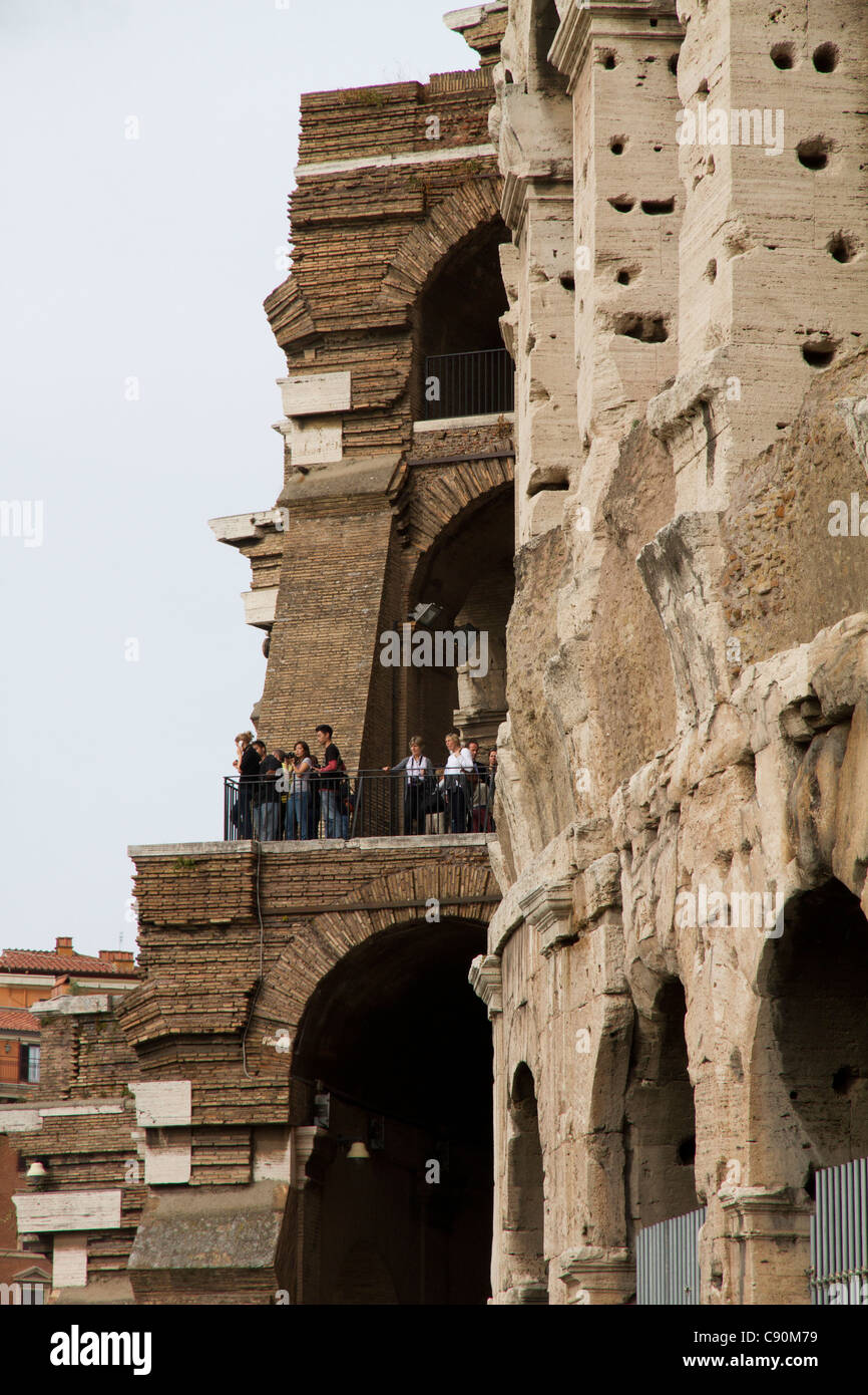 Tourists looking Colosseum monument, Rome Italy Stock Photo - Alamy