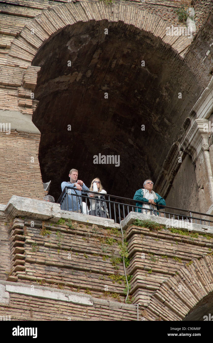 Tourists looking standing in a balcony of Colosseum monument, Rome ...