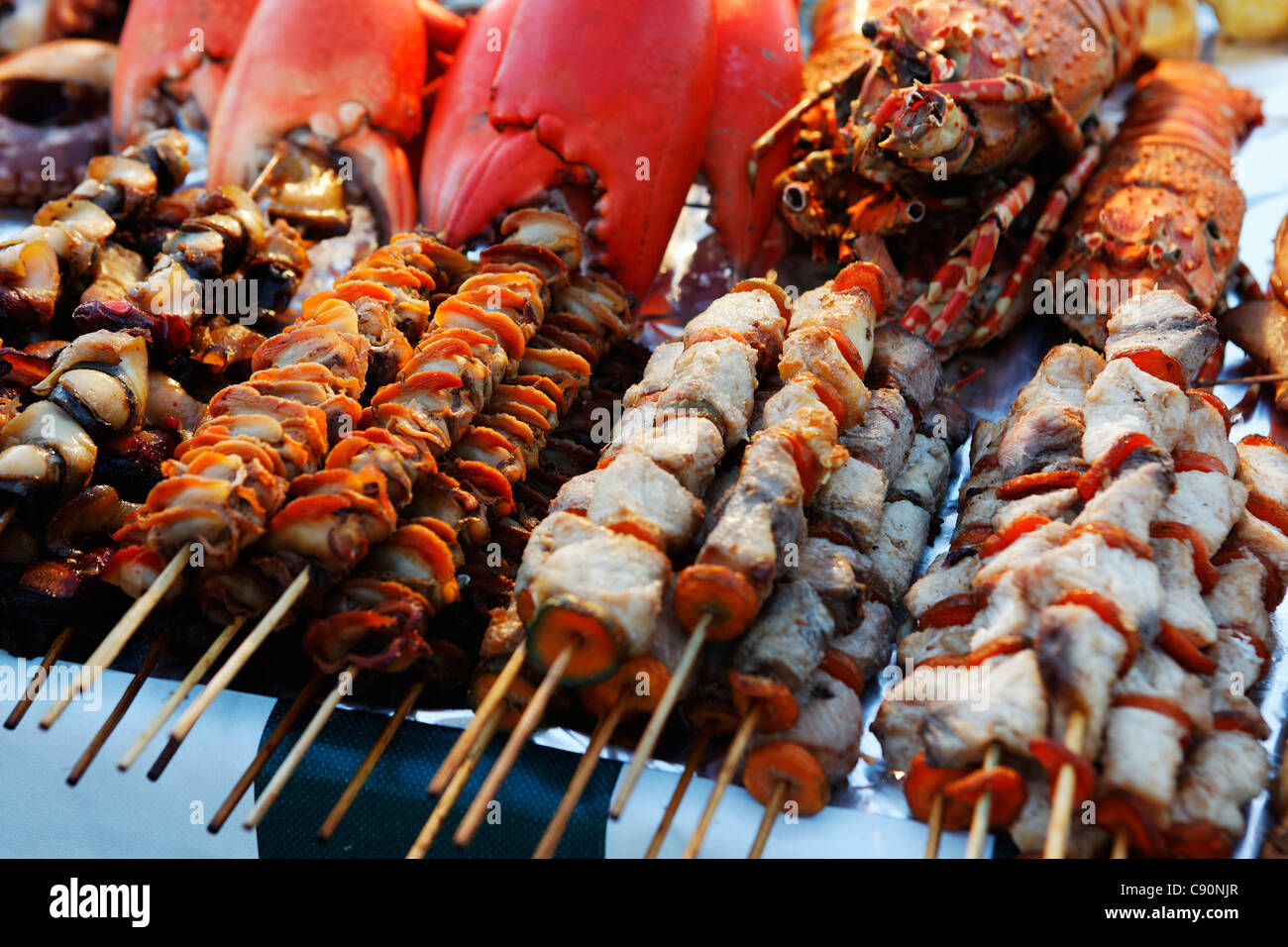 Fish skewers at a stand at the night market, Forodhani Gardens ...