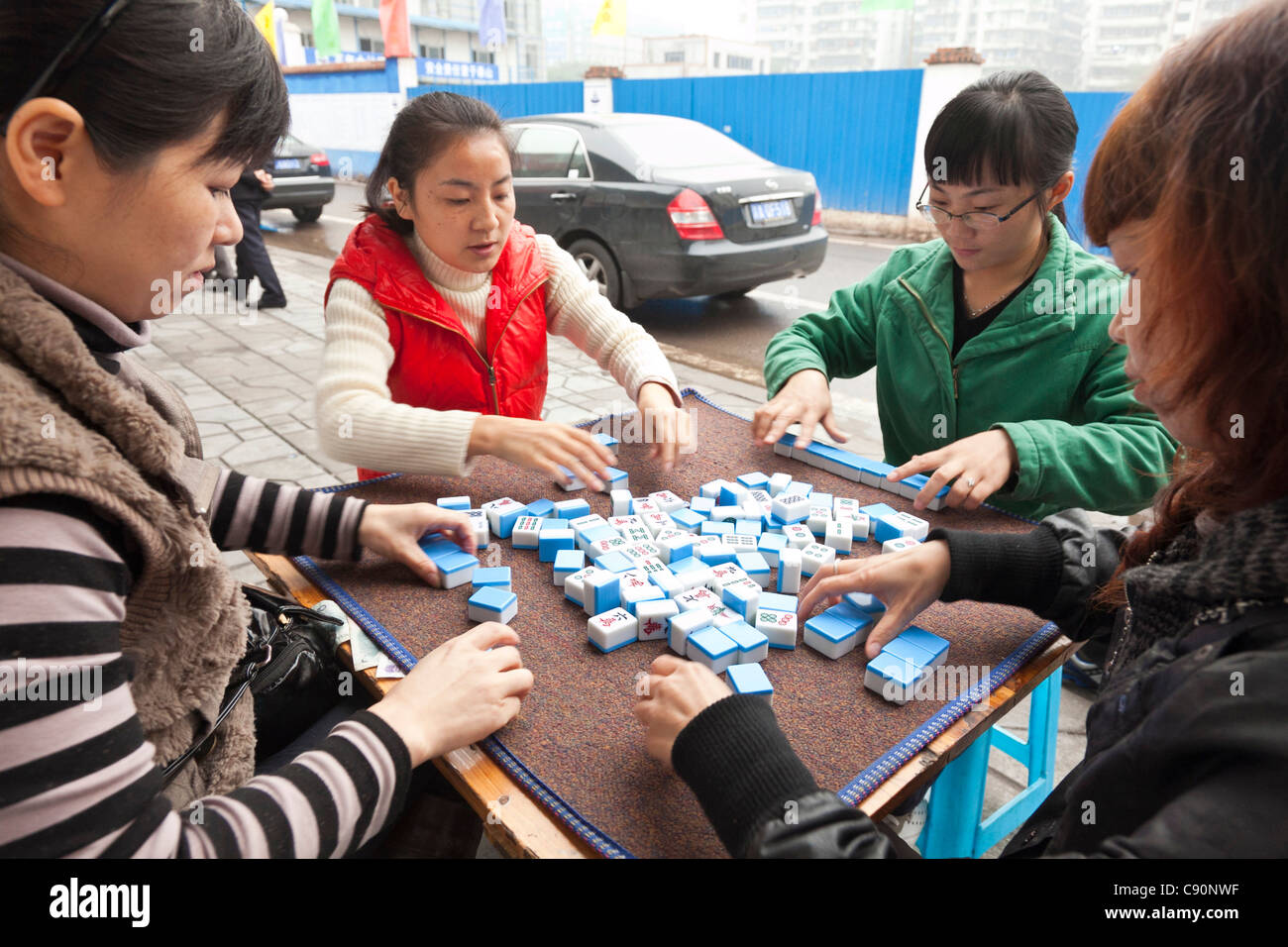 Women playing Majiang, Mahjong, Chinese board game, on the street ...