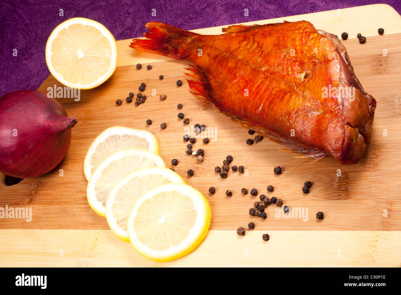 smoked fish on the kitchen board Stock Photo - Alamy