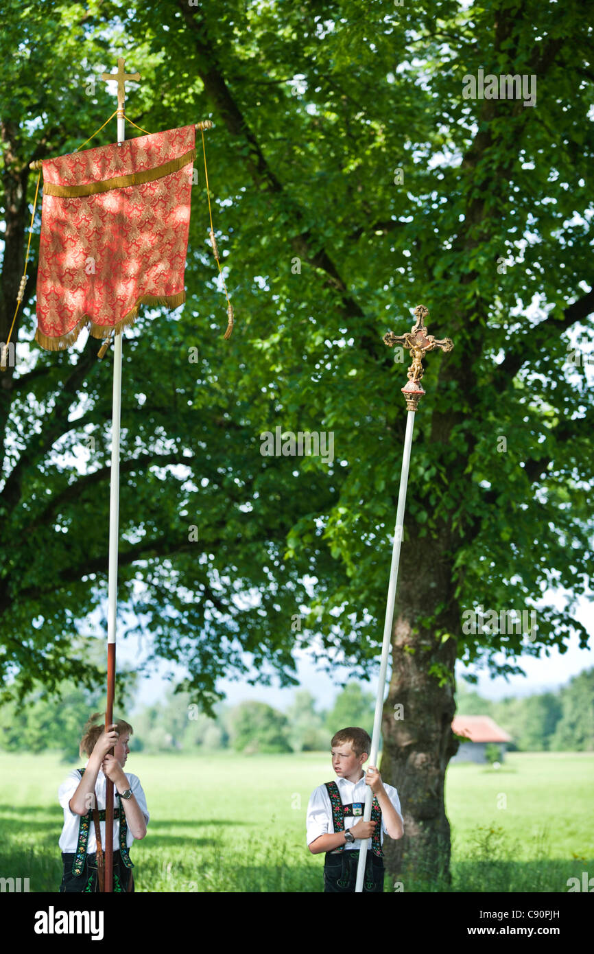 Two boys holding a flag and a cross, Corpus Christi procession ...