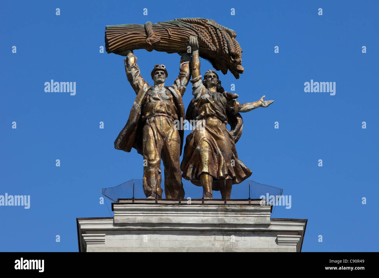 Statue of a Worker and Kolkhoz Woman on top of the main entrance at the ...