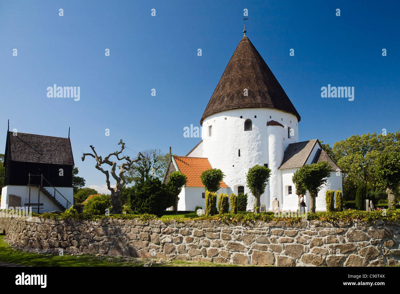 Round church Ols Kirke under blue sky, St. Ols Kirke, Bornholm, Denmark ...