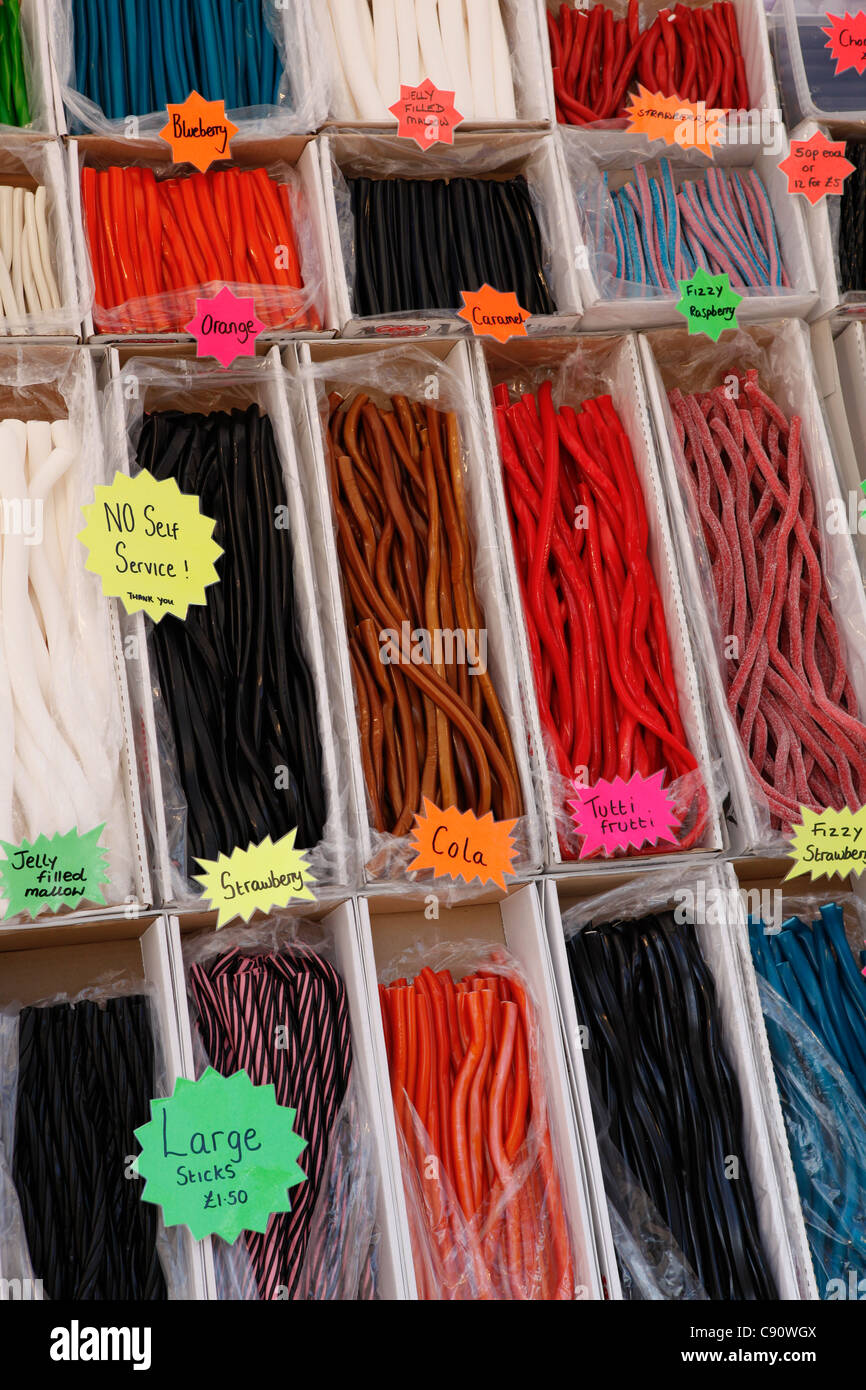 Strands of different colours and flavours liquorice on a market stall ...