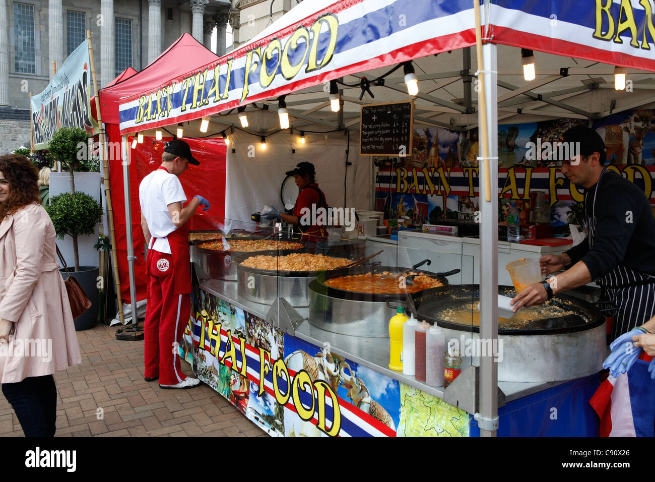 Thai food stall cooking large pans of food at the International Food ...