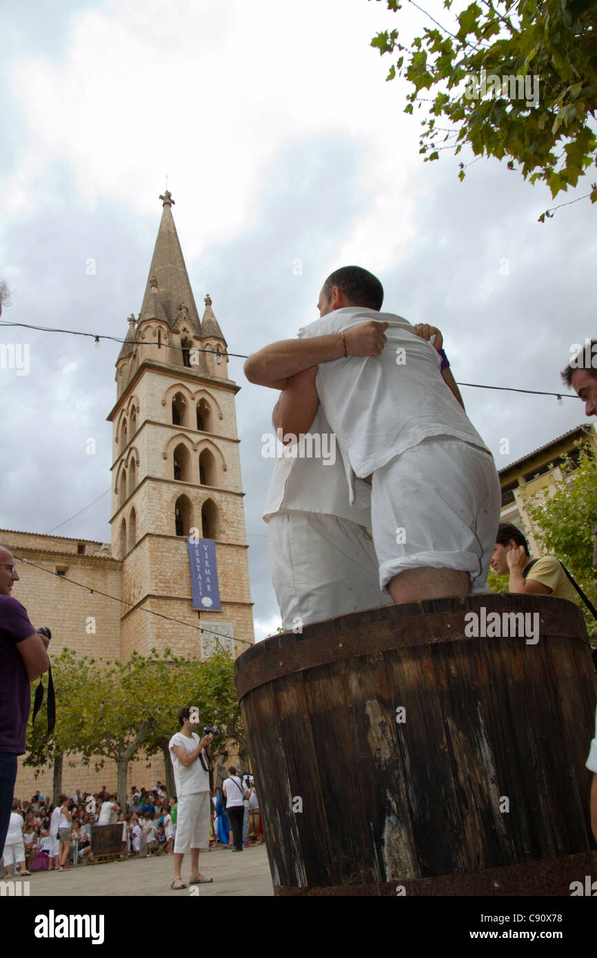 Men pressing grapes at grape harvest festival in Binissalem Mallorca ...