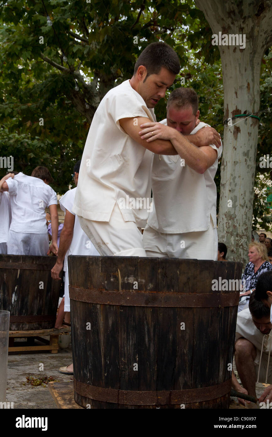 Men pressing grapes at the grape harvest festival in Binissalem ...