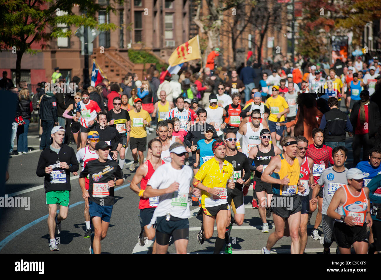 Runners pass through Harlem near the 22 mile mark in the 42nd Annual ...