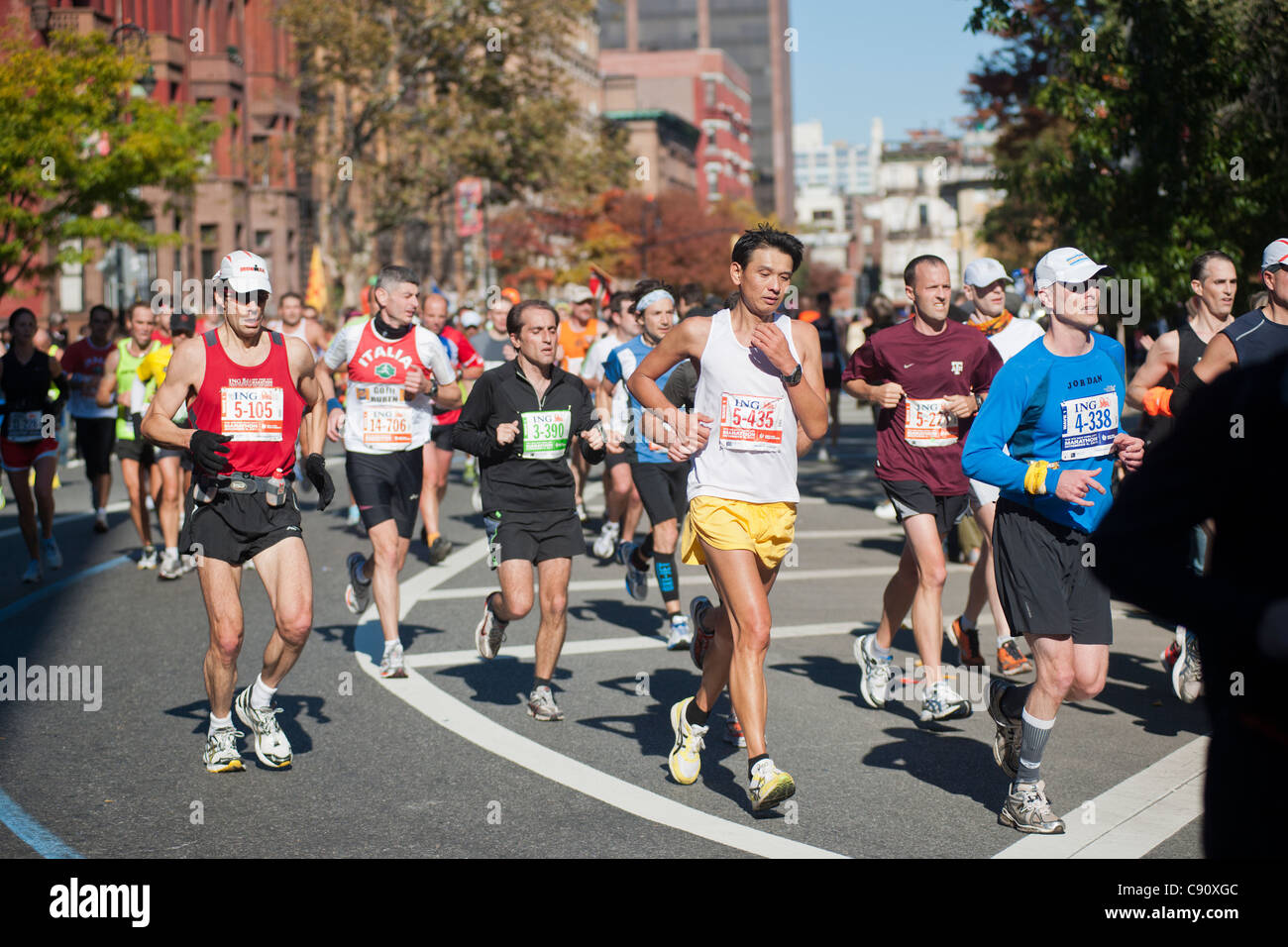 Runners pass through Harlem near the 22 mile mark in the 42nd Annual ...