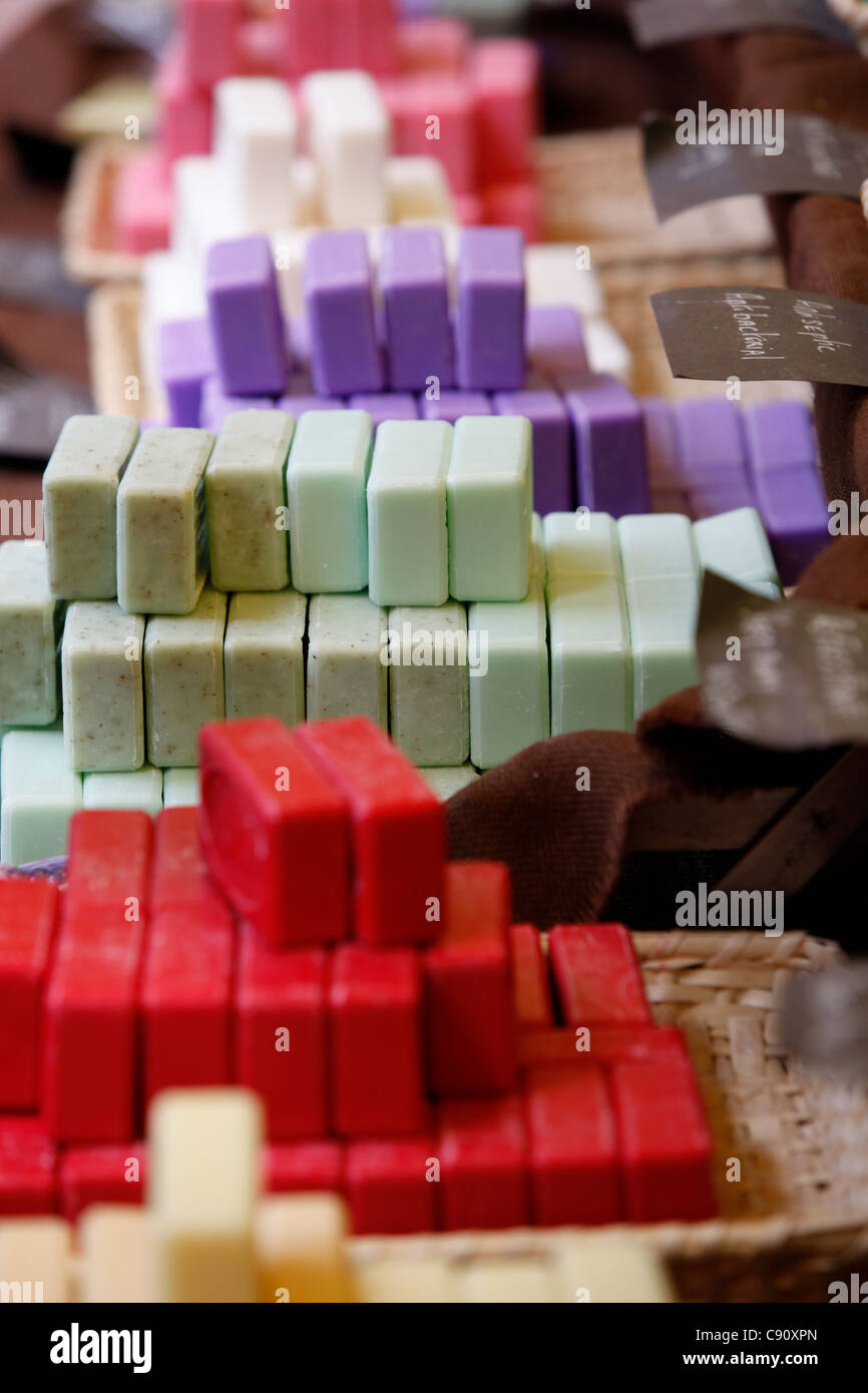 Colourful handmade soaps displayed on a market stall Stock Photo - Alamy