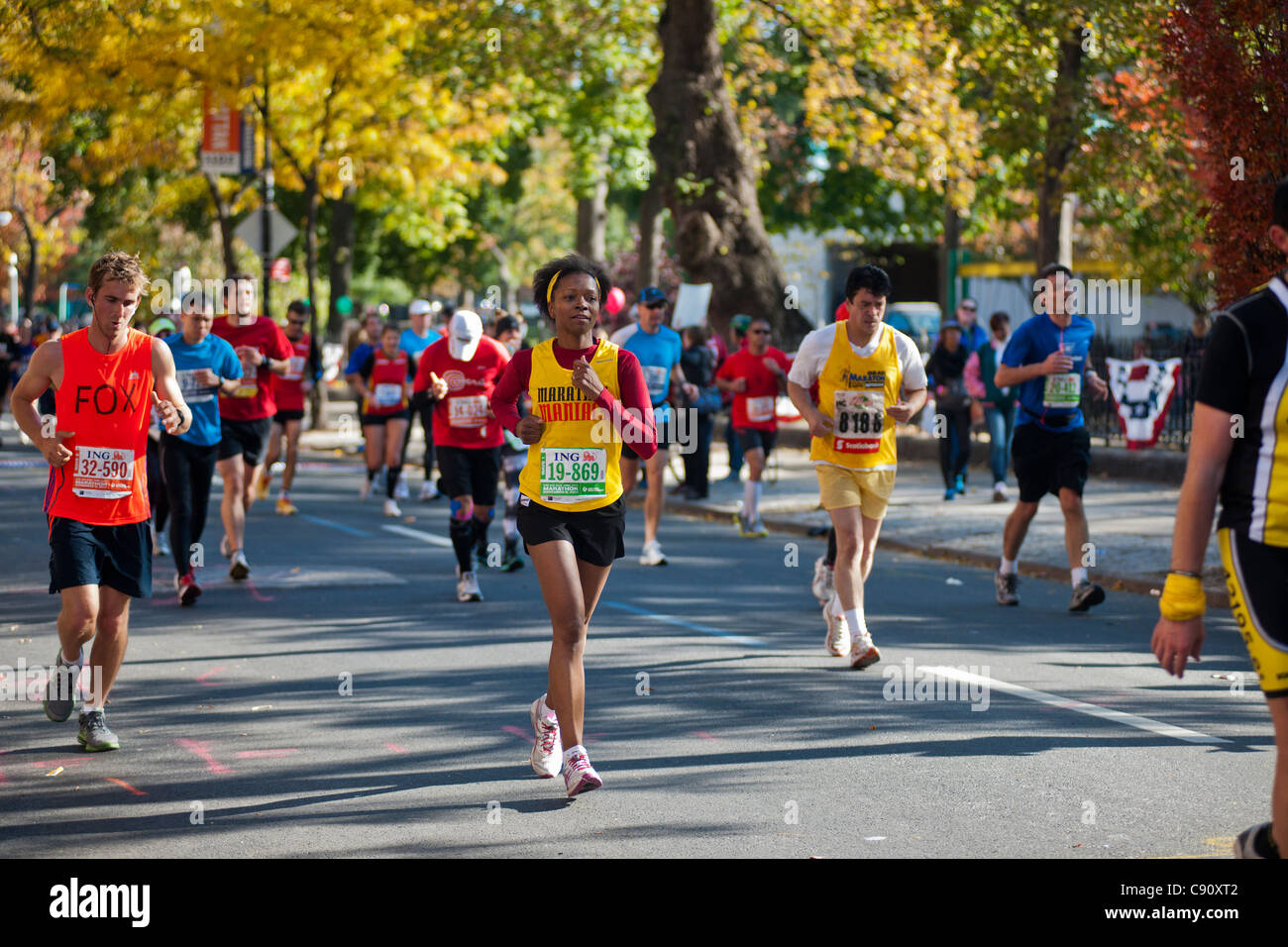 Runners pass through Harlem near the 22 mile mark in the 42nd Annual ...