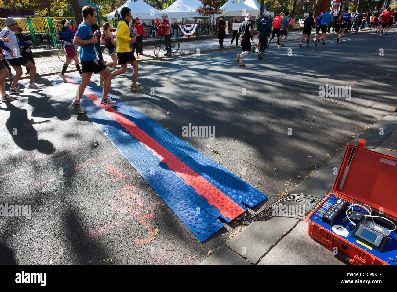 Runners pass an RF device that records a signal from a chip on their ...
