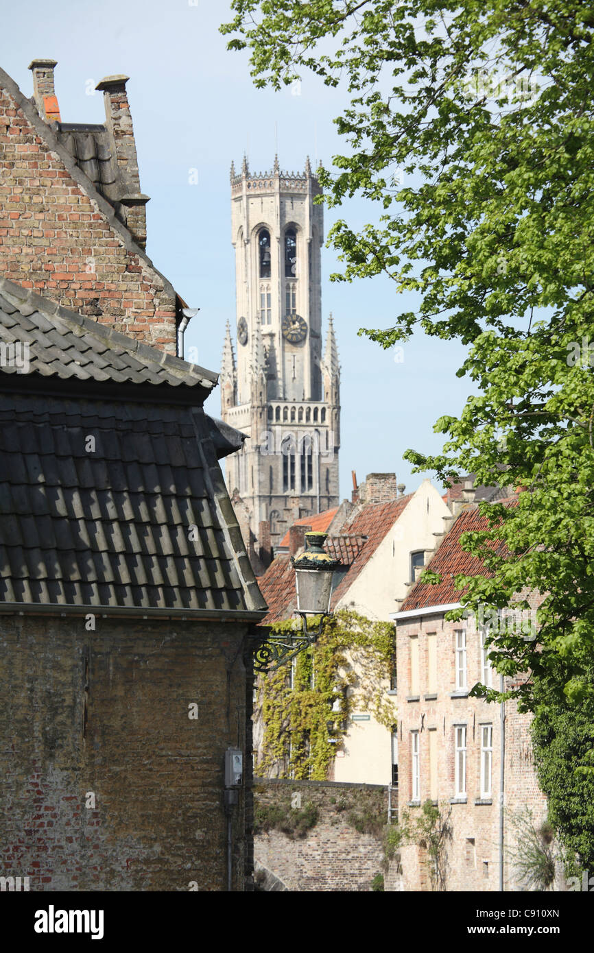 The Belfry tower and the historic medieval buildings along the canals ...